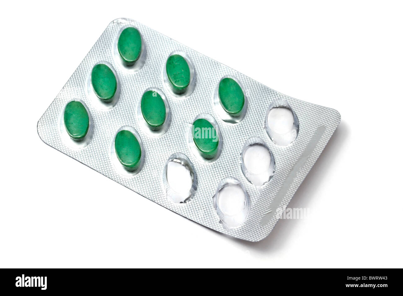 green pills isolated on white background Stock Photo - Alamy