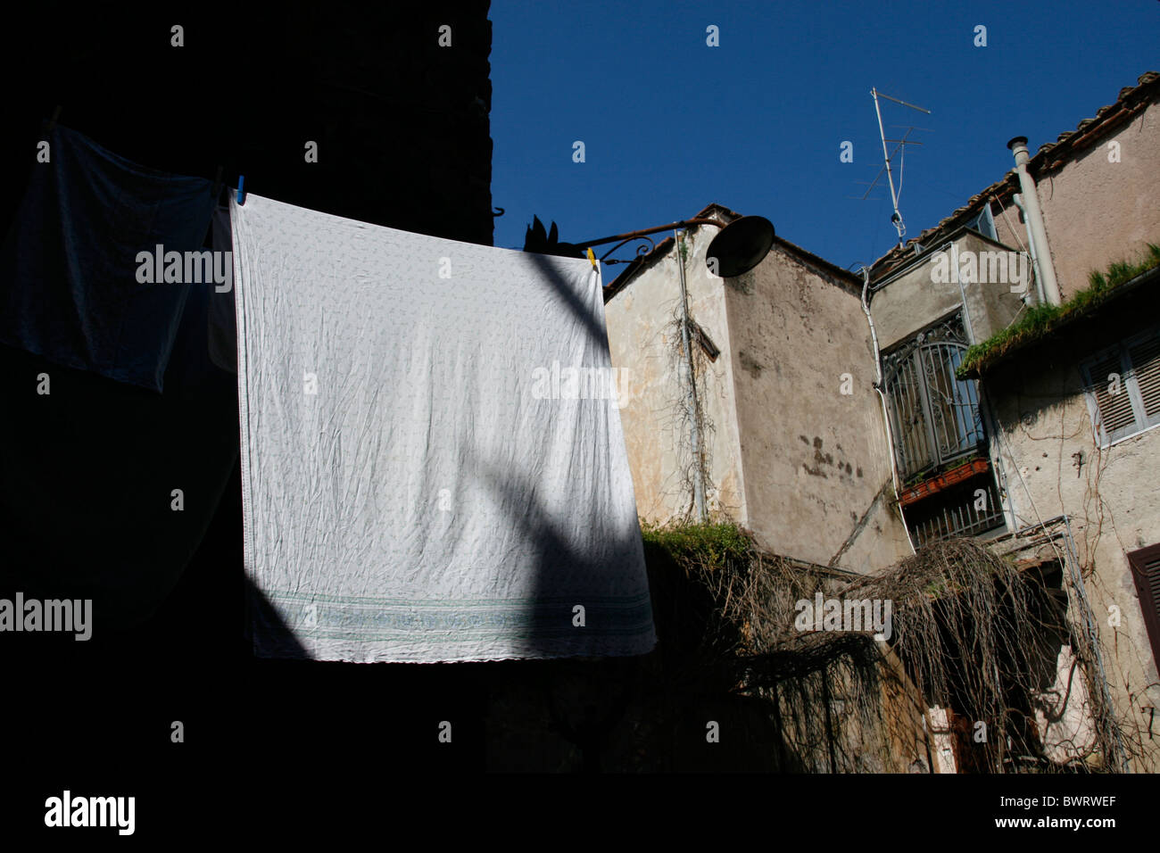 bed sheets on washing line outdoors in sun in italy Stock Photo - Alamy
