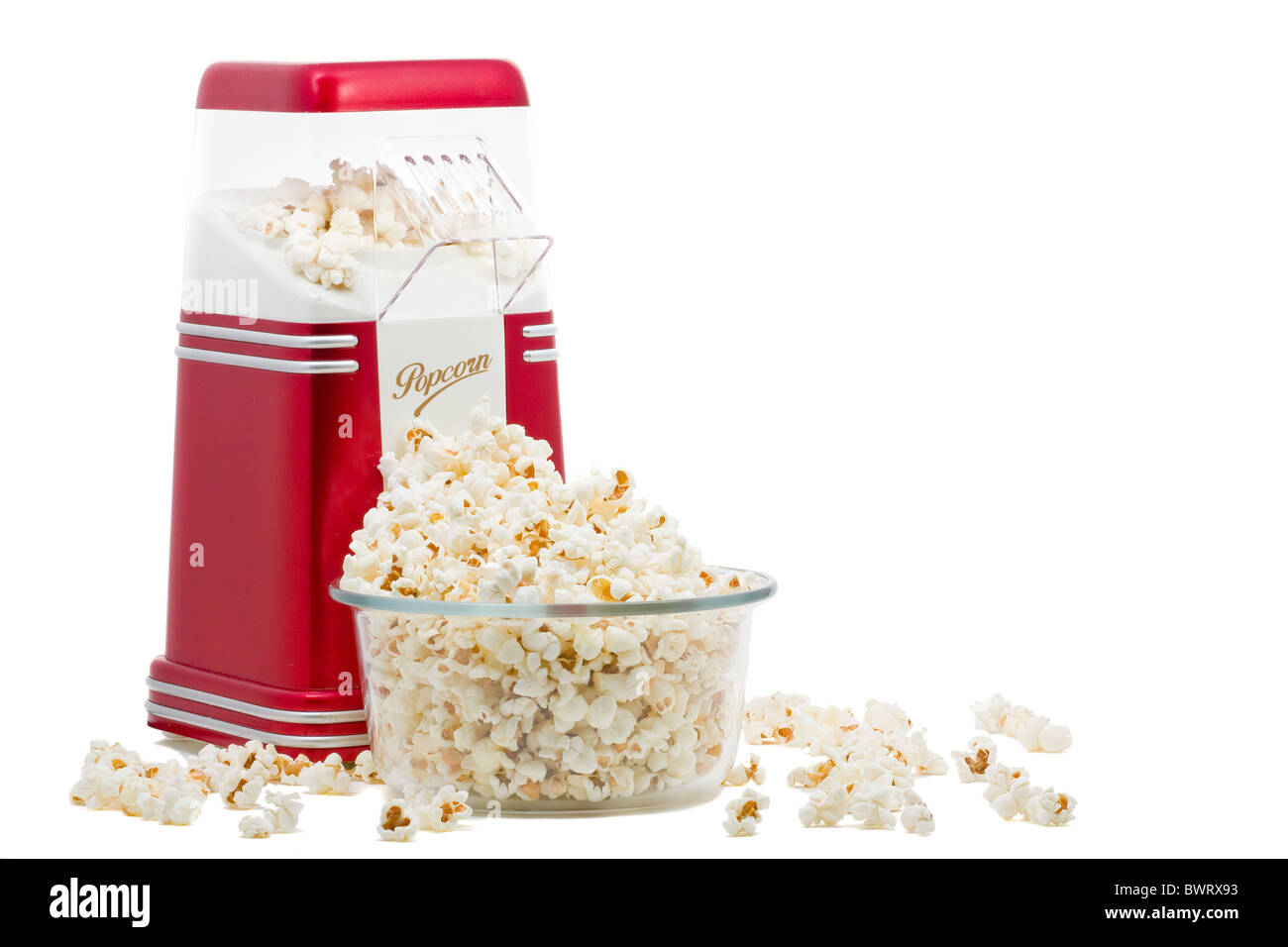 Popcorn machine with popcorn over white background Stock Photo - Alamy