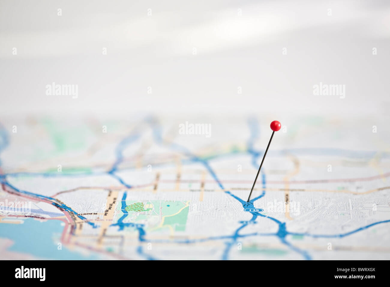 Red map pin in road hi-res stock photography and images - Alamy