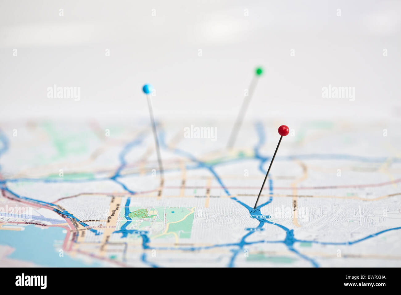 colored map pins in colorful paper map Stock Photo - Alamy