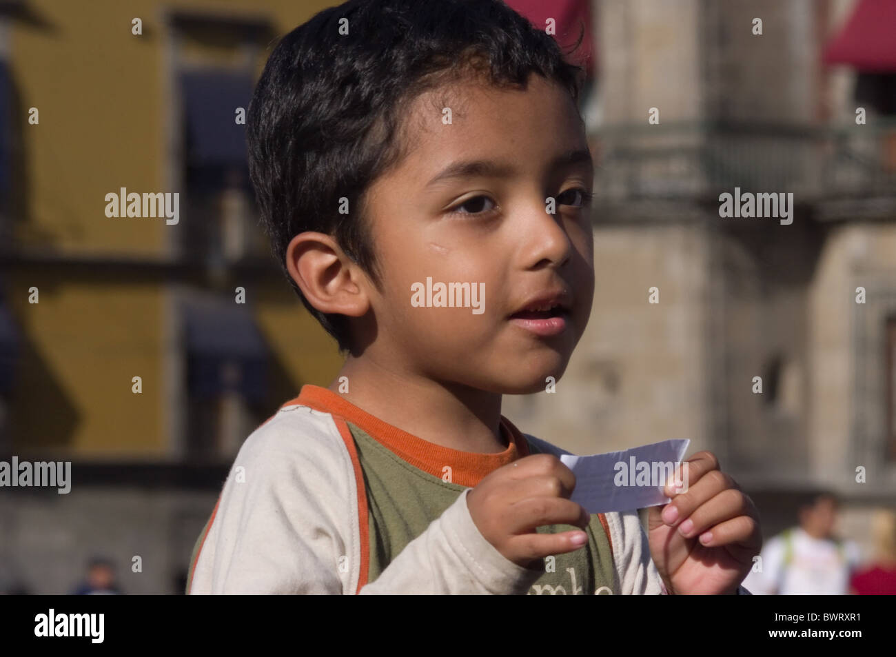 Head shot of a Mexican kid in the streets Stock Photo - Alamy