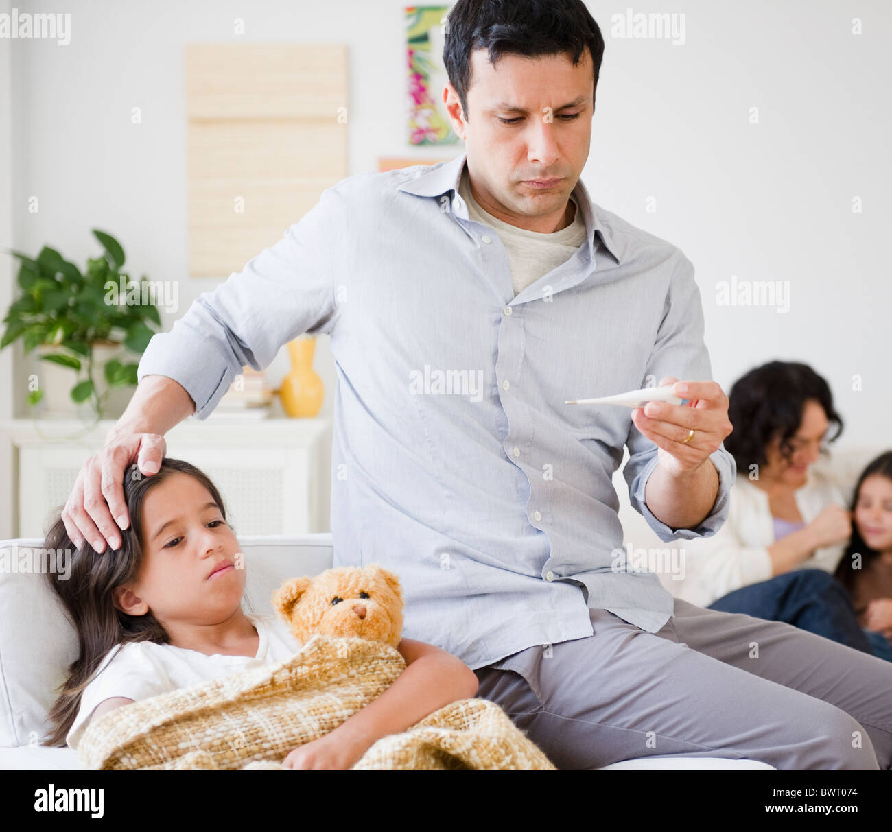 Woman taking husband temperature hi-res stock photography and images ...