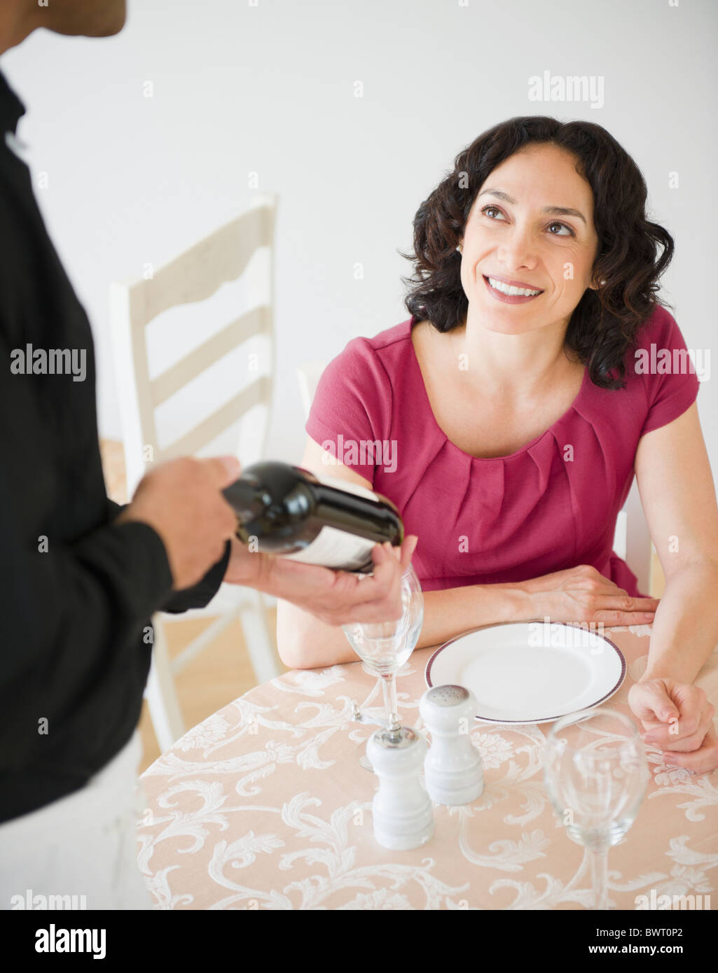 Waiter showing people to table hi-res stock photography and images - Alamy