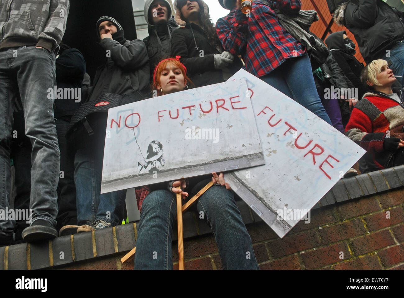Girl with placards protesting against rising tuition fees, Bristol ...