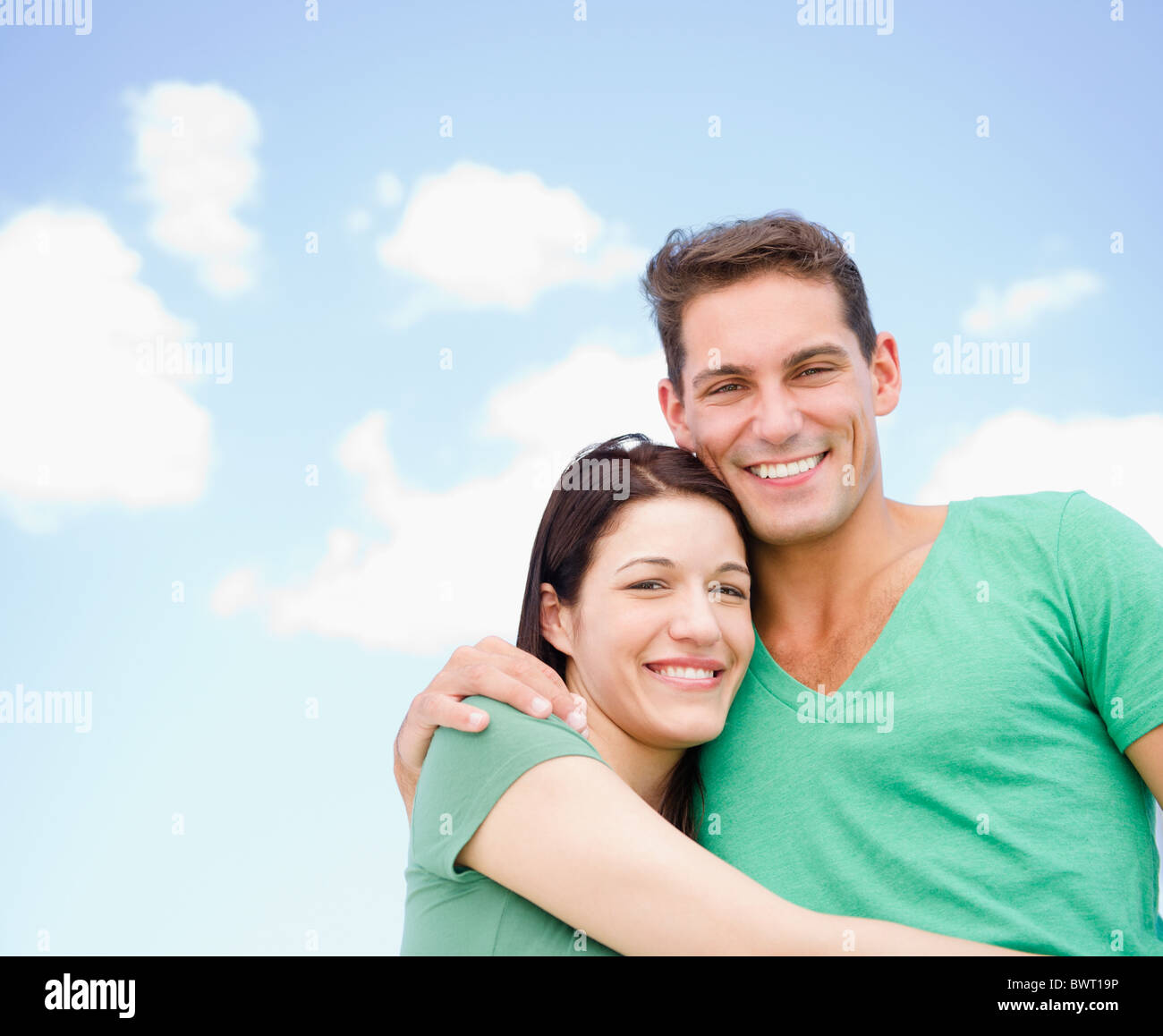 Smiling couple hugging Stock Photo - Alamy