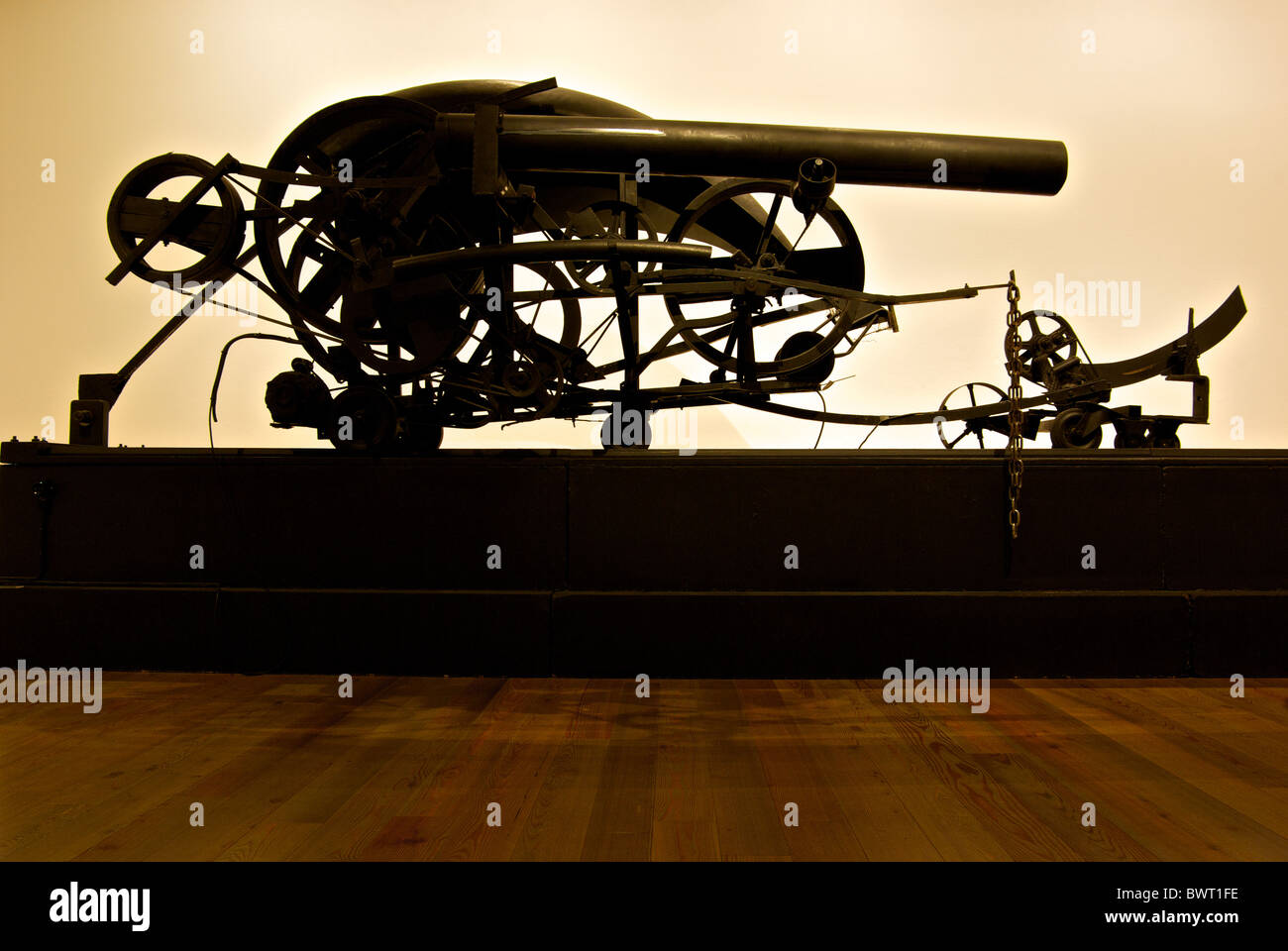 Large Jean Tinguely sculptural kinetic art work in silhouette at museum ...