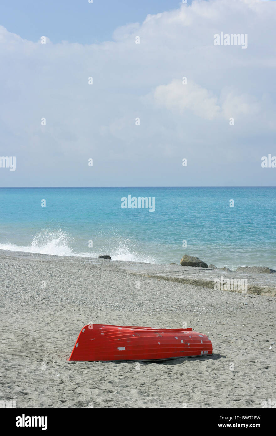 Red rowing boat on a beach Stock Photo - Alamy