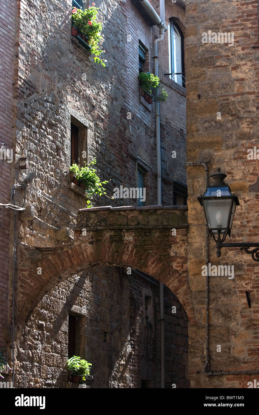 Volterra Tuscany Italy houses in alley historical facade with windows ...