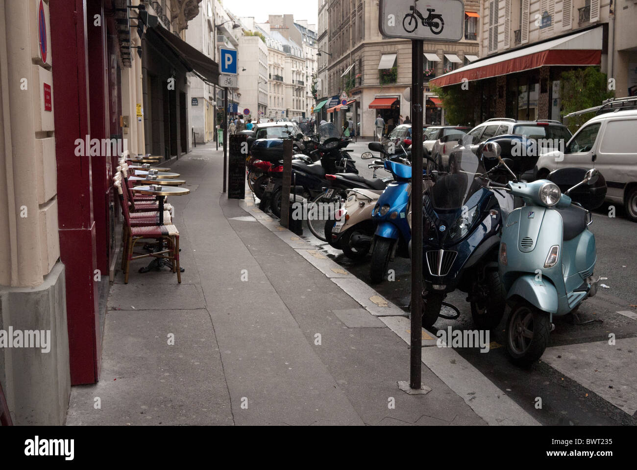 empty Paris street scene with cafe and scooters Stock Photo - Alamy