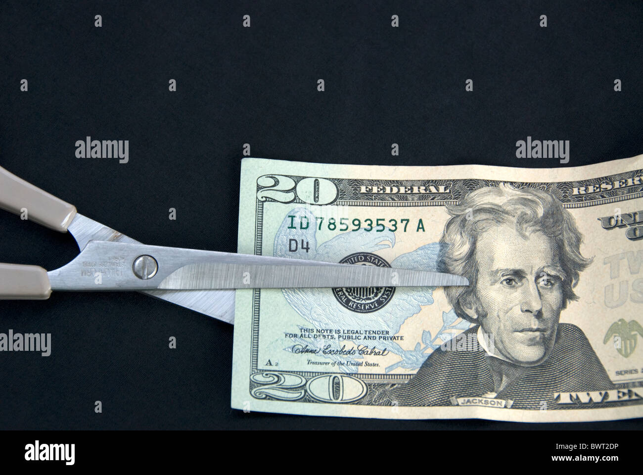 U.S. twenty dollar bill being cut by scissors Stock Photo - Alamy
