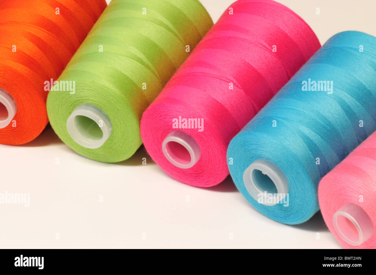Group of multicolored sewing threads Stock Photo - Alamy