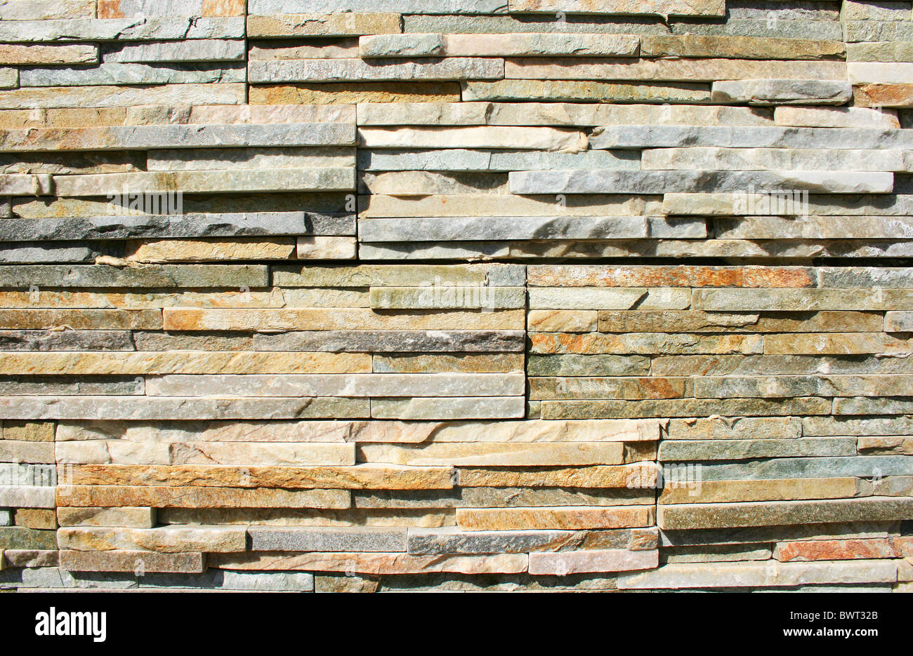 Colorful stones wall as a background Stock Photo - Alamy