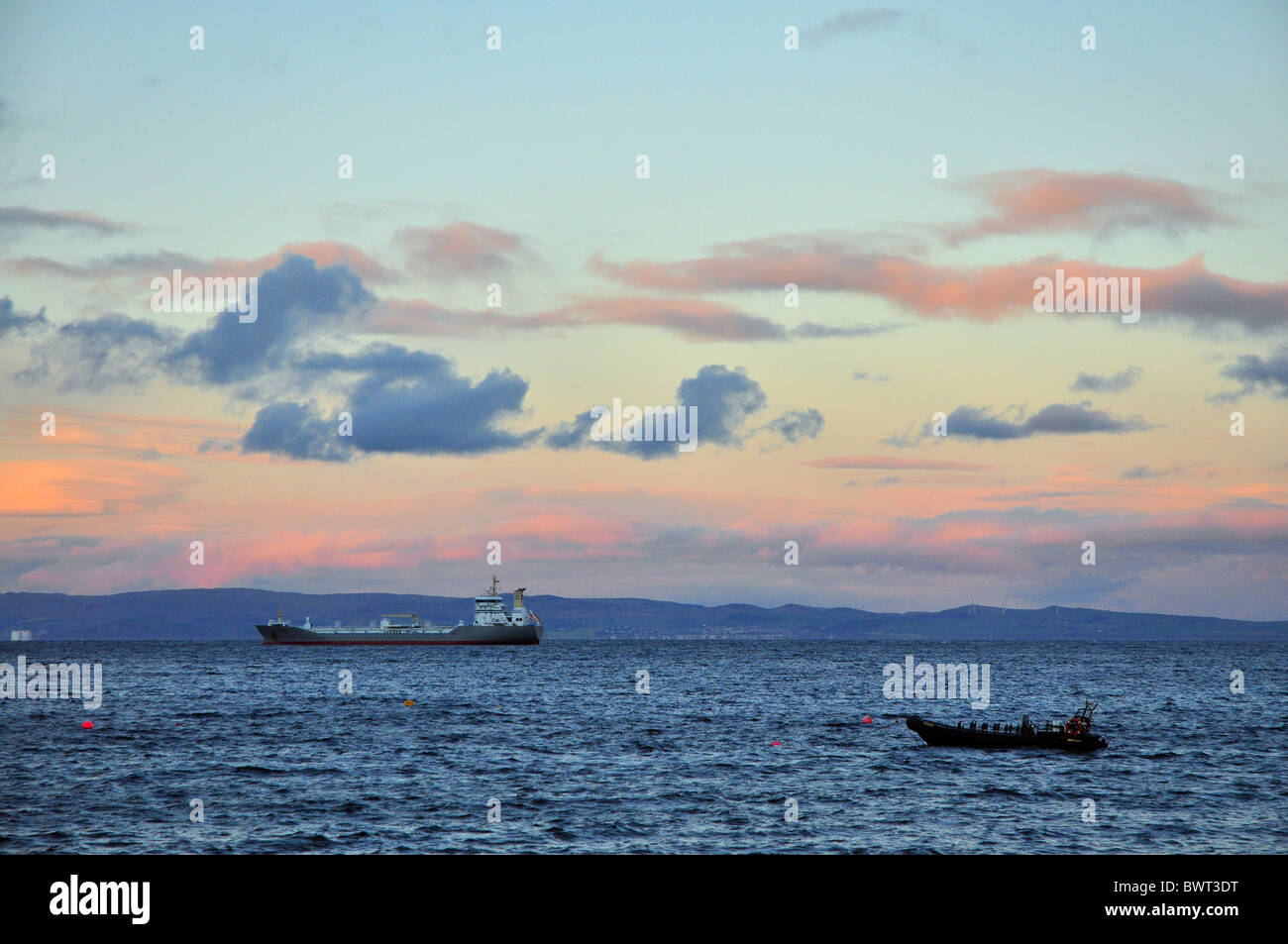 Ships at sea at sunset, Firth of Clyde, Scotland, UK Stock Photo - Alamy