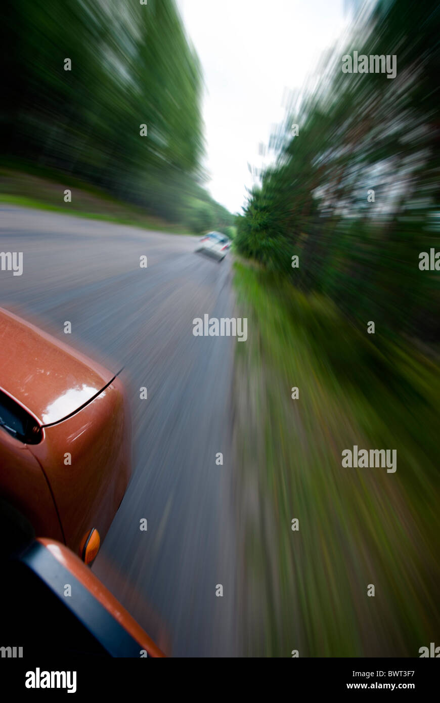 car drive by empty road Stock Photo - Alamy