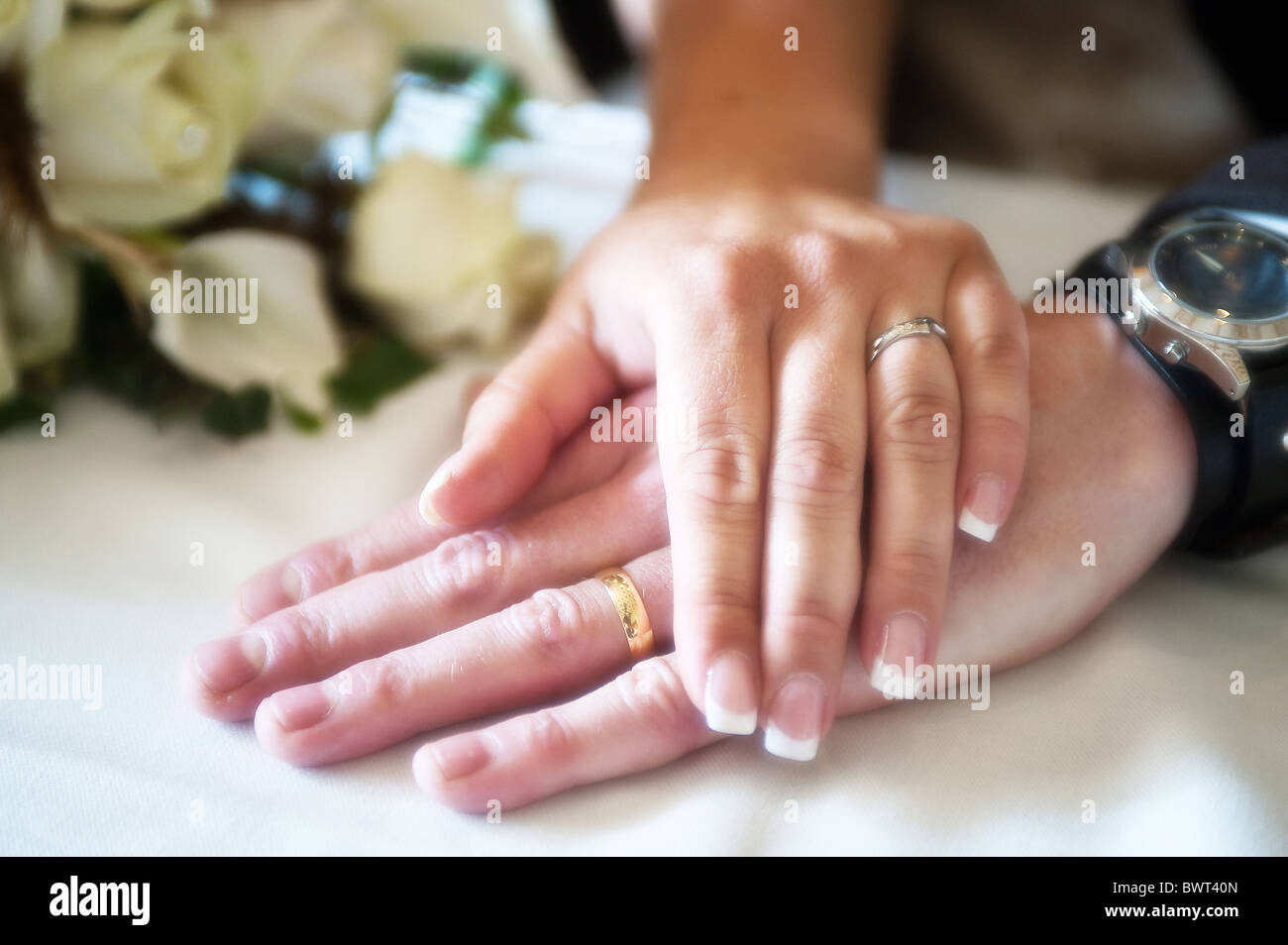 bride and groom hands showing wedding rings Stock Photo - Alamy