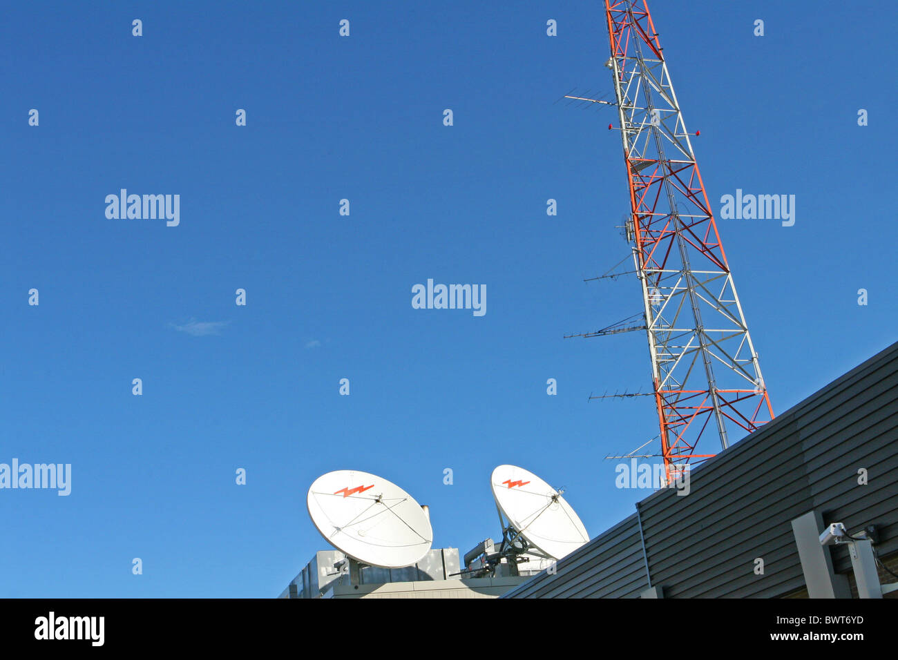 Communication satellite dishes and tower Stock Photo - Alamy