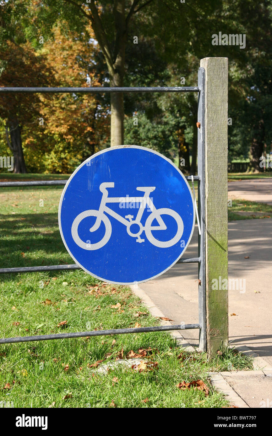 Bike sign on gate cycle path Stock Photo - Alamy
