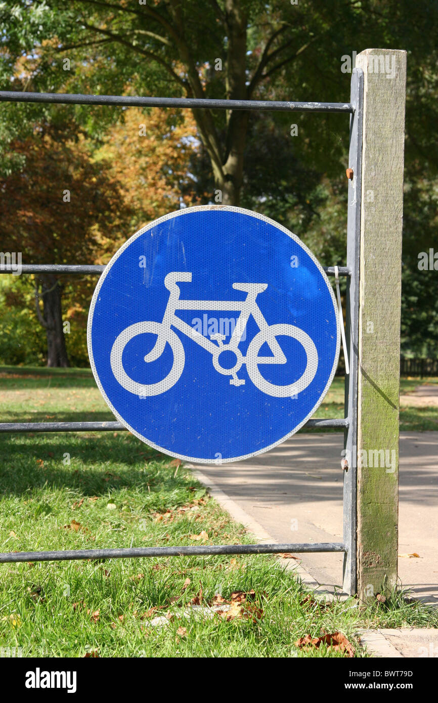 Bike sign on gate cycle path Stock Photo - Alamy
