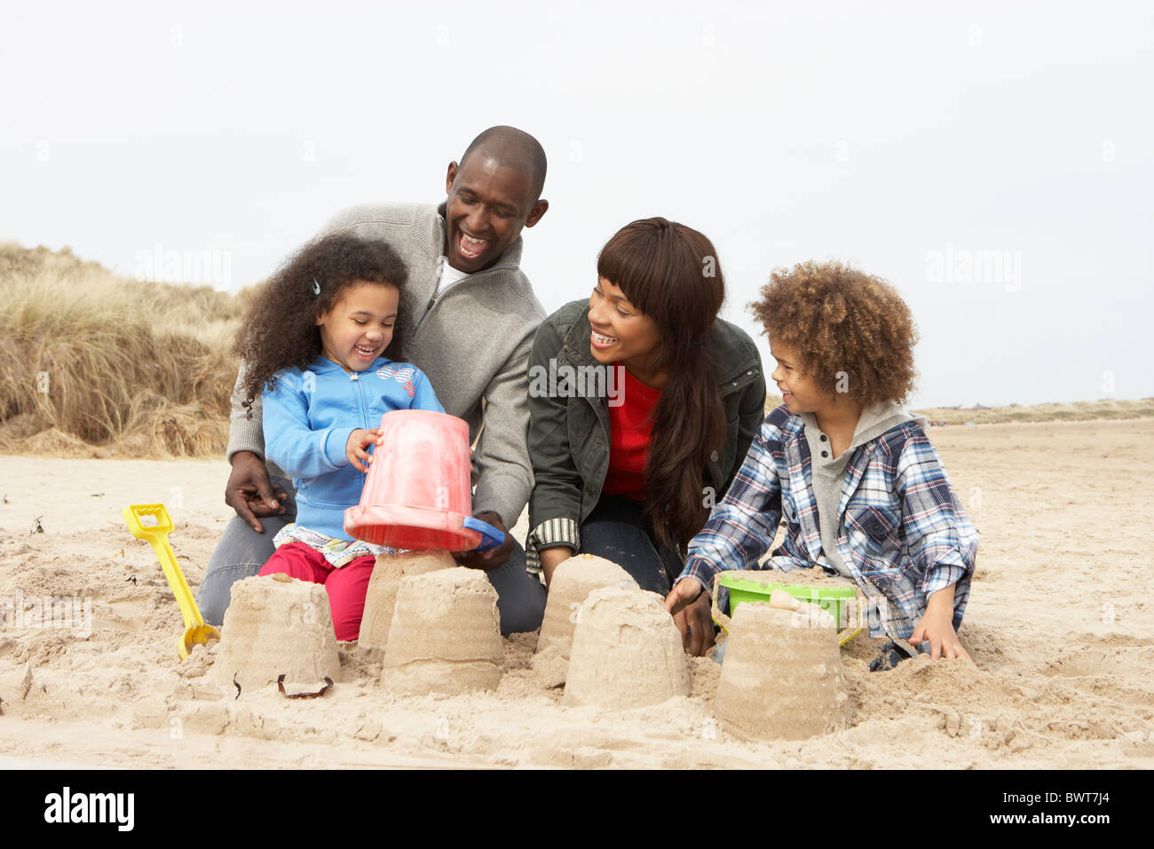 Man building sandcastle hi-res stock photography and images - Alamy