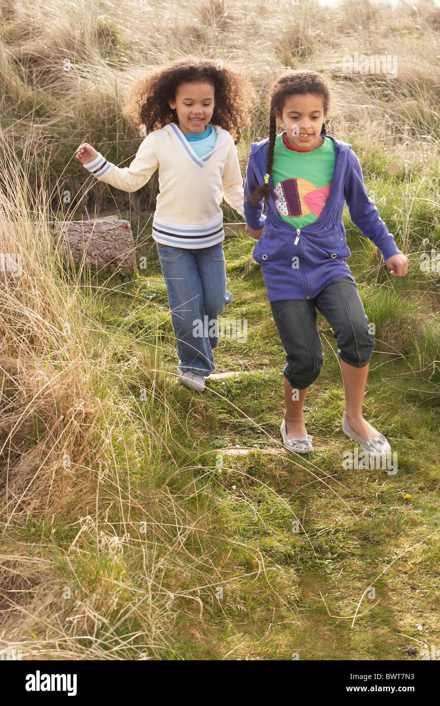 Young Girls Playing In Field Together Stock Photo - Alamy