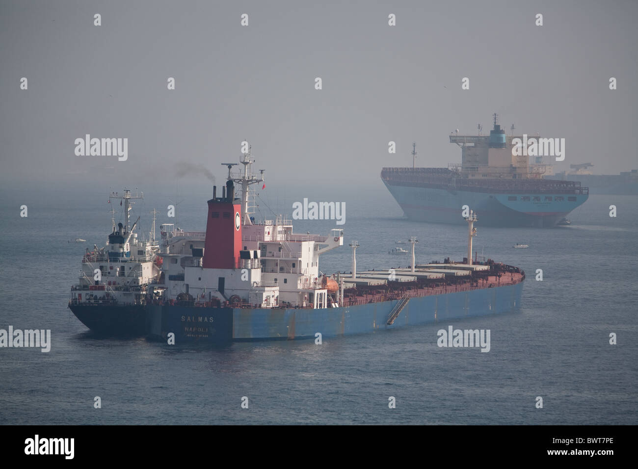 Cargo ships and tankers in morning mist Gibraltar bay Stock Photo - Alamy