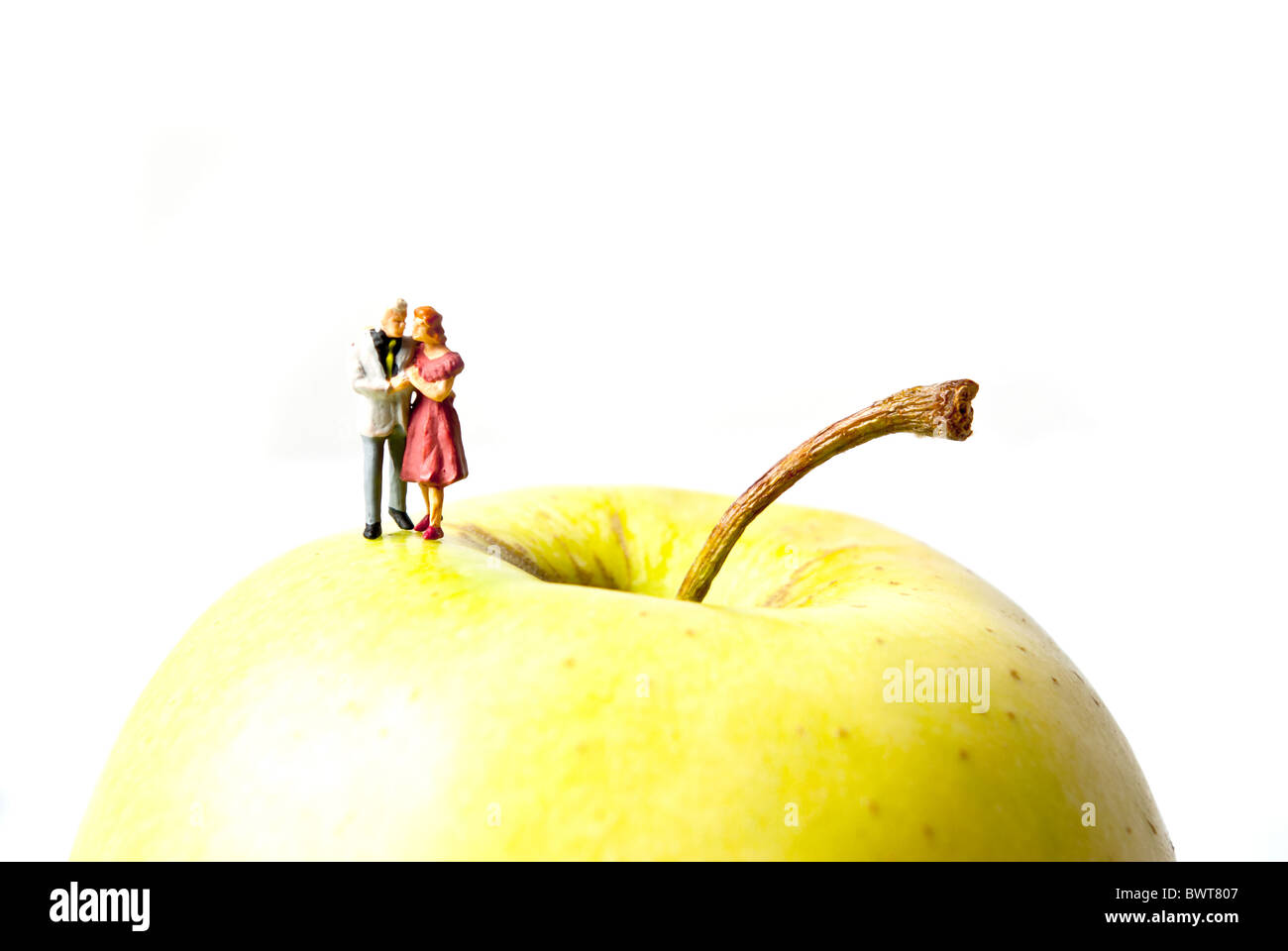 two people on apple Stock Photo - Alamy