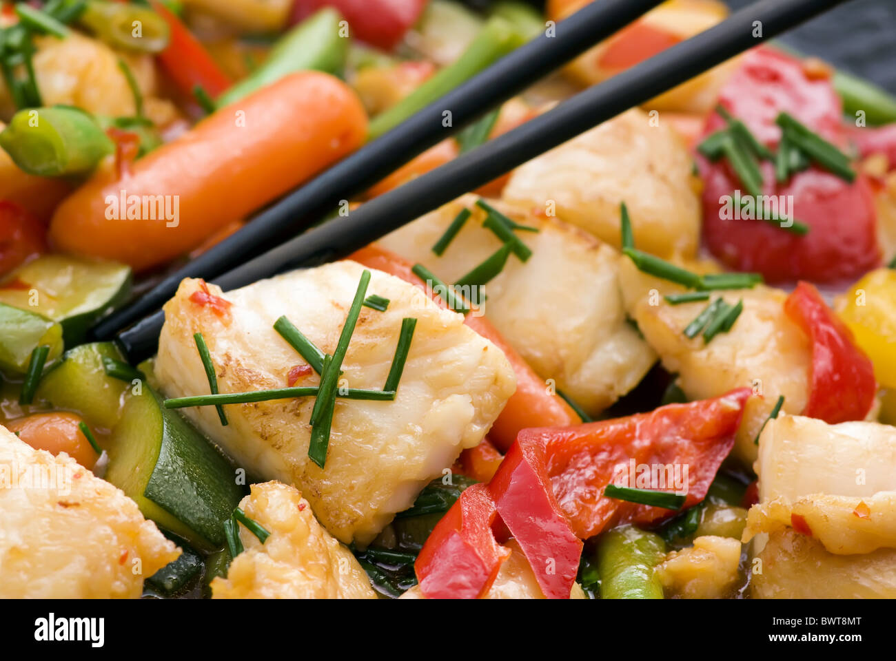 Thai Fish with Vegetable as closeup in a wok Stock Photo - Alamy