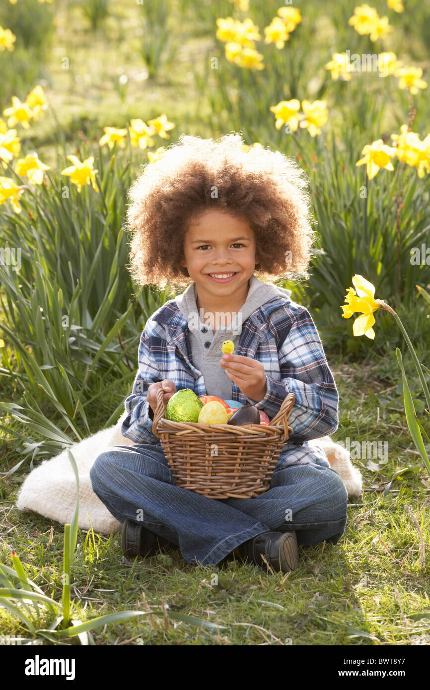 Boy On Easter Egg Hunt In Daffodil Field Stock Photo - Alamy