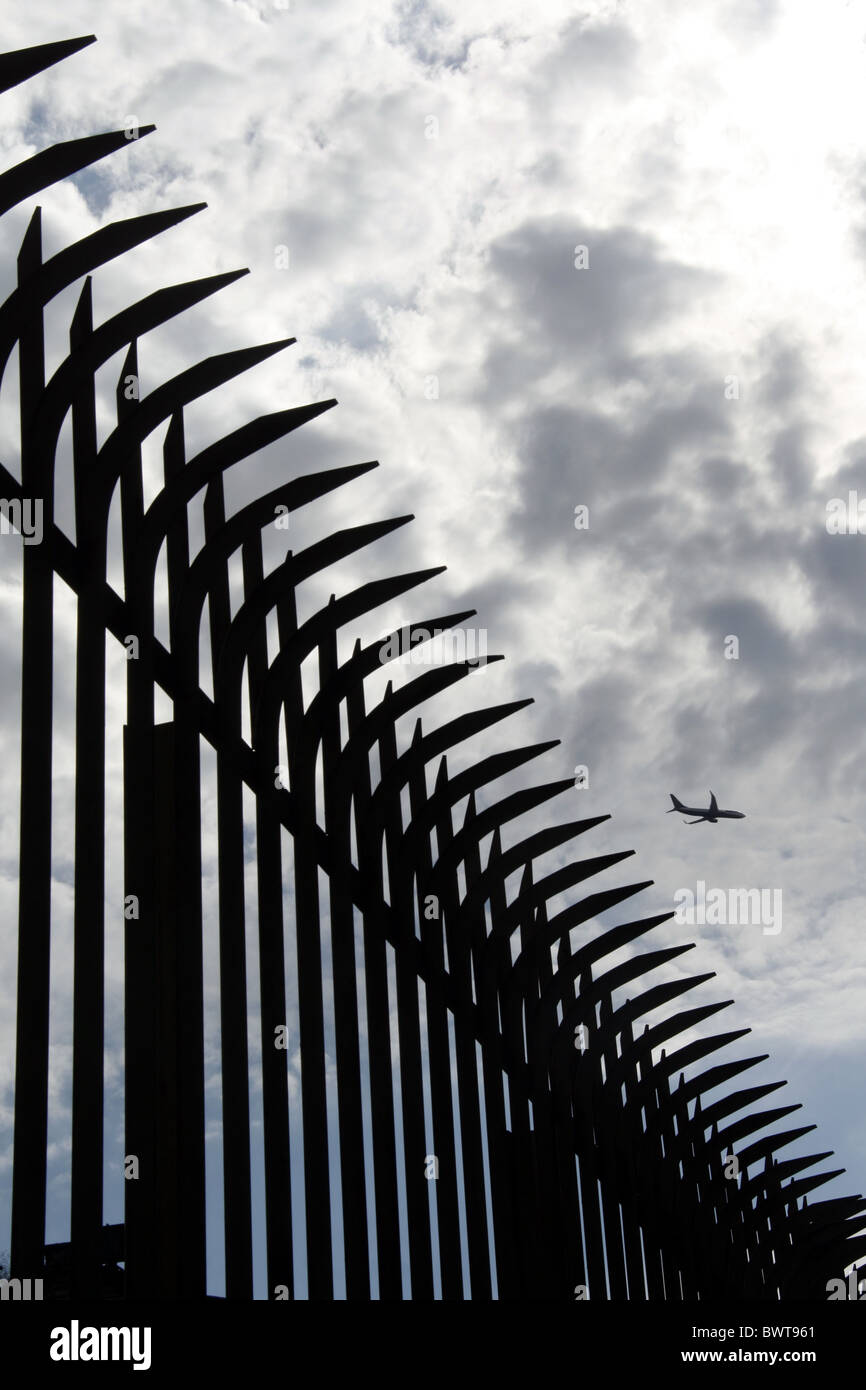 plane and high metal fence with spikes and dark sky Stock Photo - Alamy