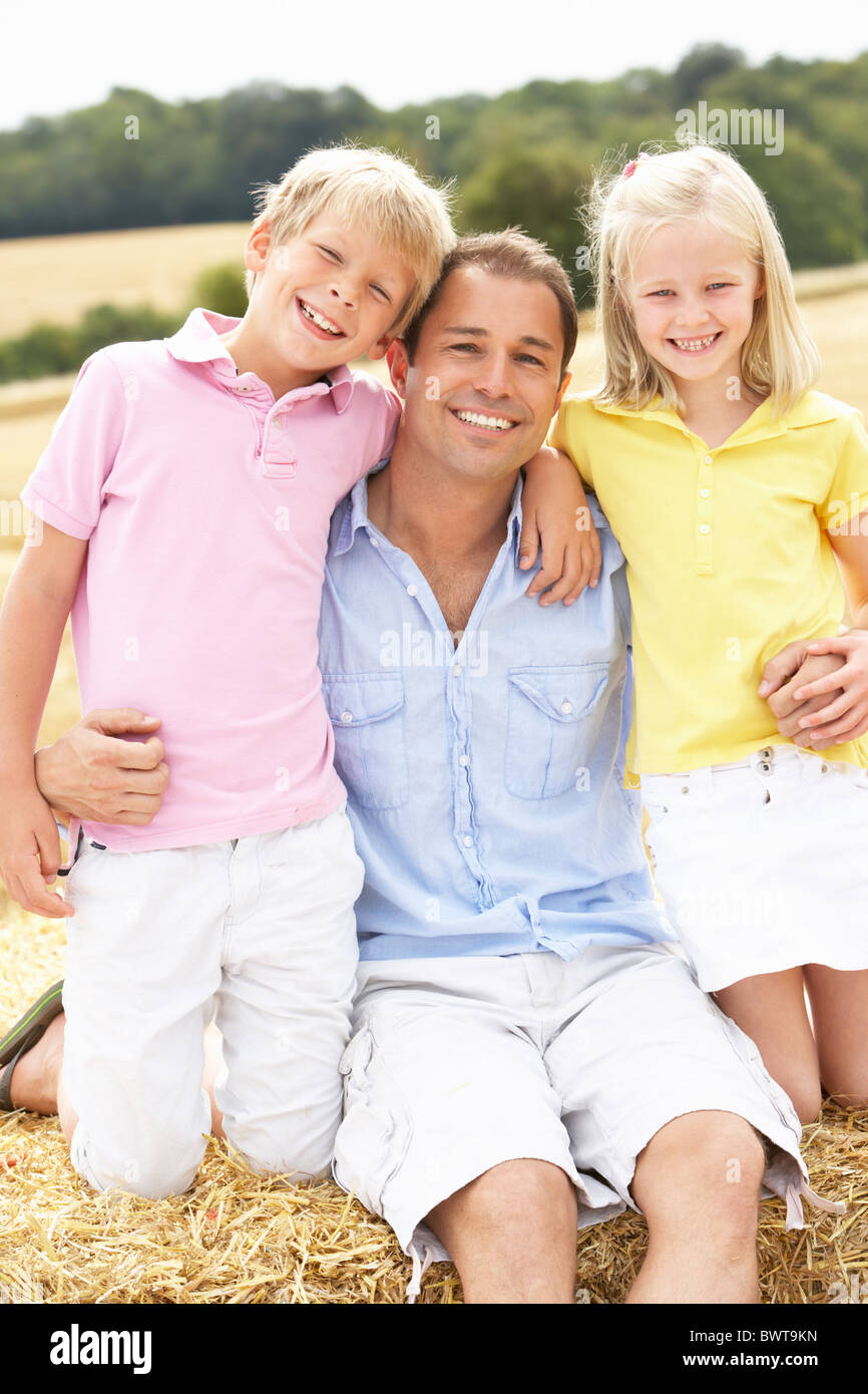 Children sitting on hay bales hi-res stock photography and images - Alamy