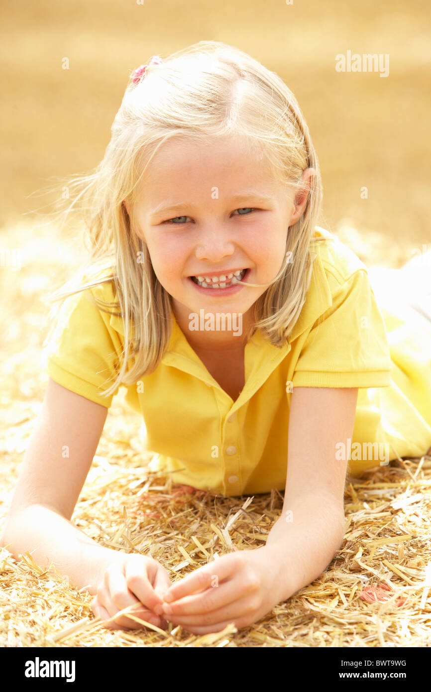 Portrait Of Girl Laying In Summer Harvested Field Stock Photo - Alamy