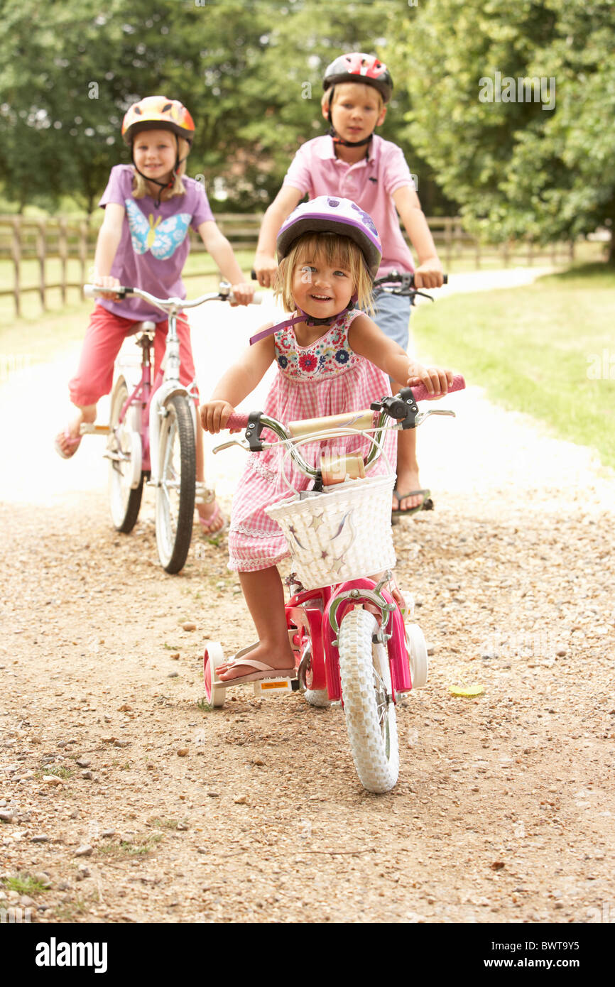 Children In Countryside Wearing Safety Helmets Stock Photo - Alamy