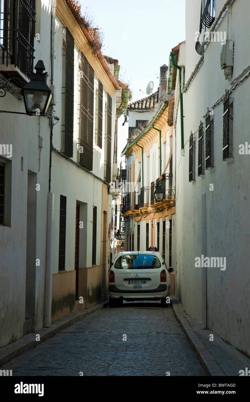 Car driving in a narrow cobbled alley, Cordoba, Andalucia, Spain Stock ...