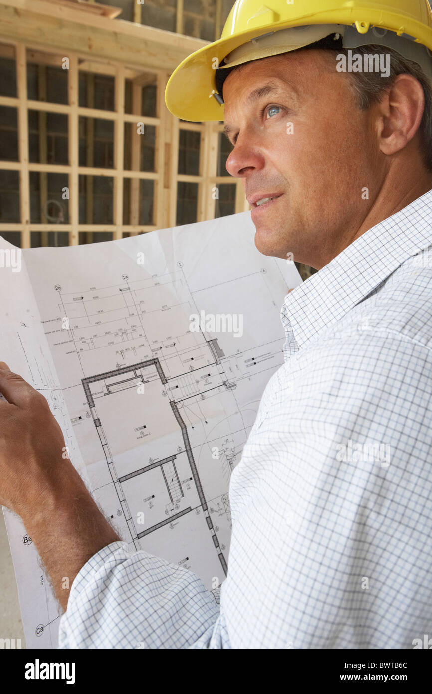 Architect With Plans In New Home Stock Photo - Alamy