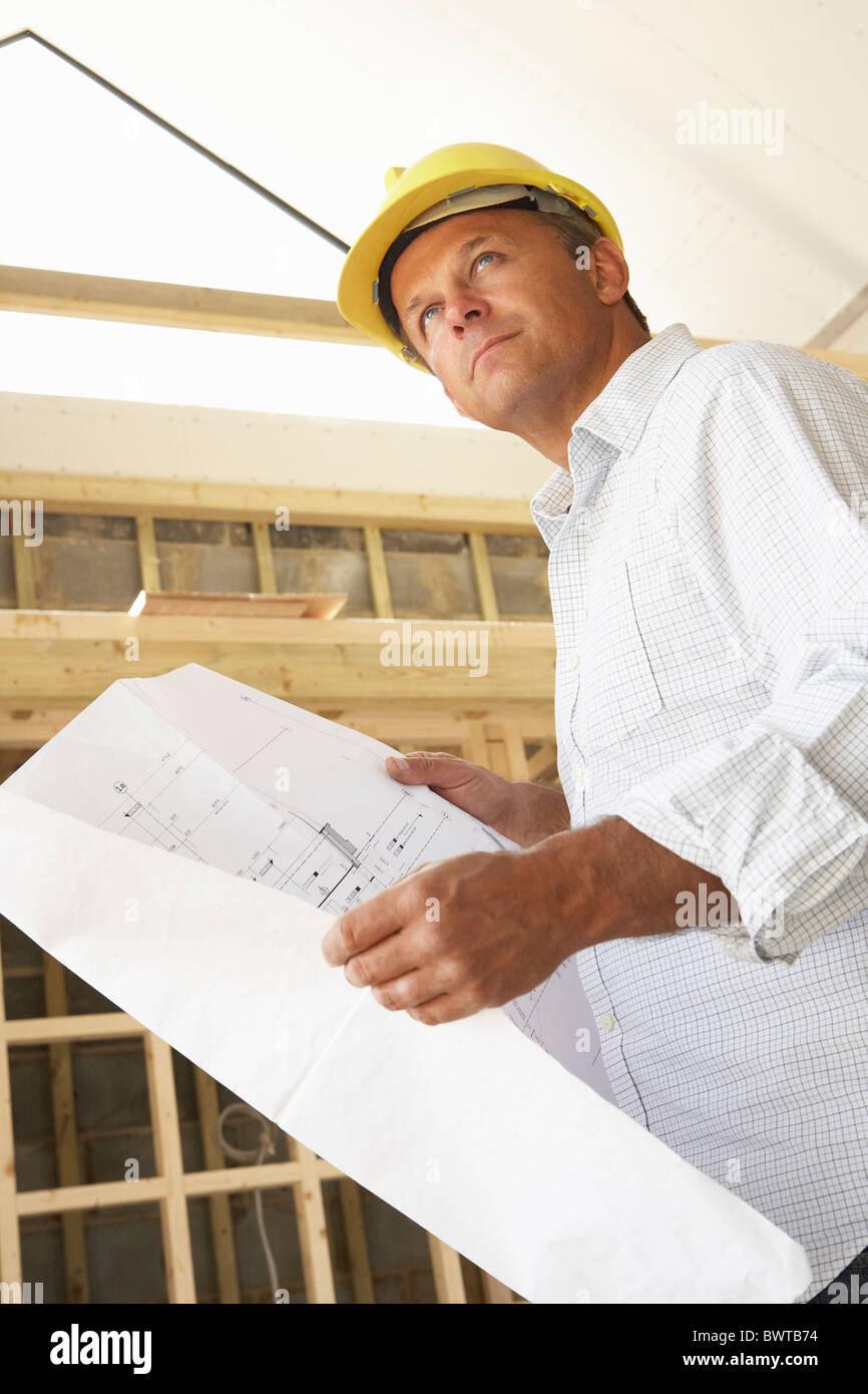 Architect With Plans In New Home Stock Photo - Alamy