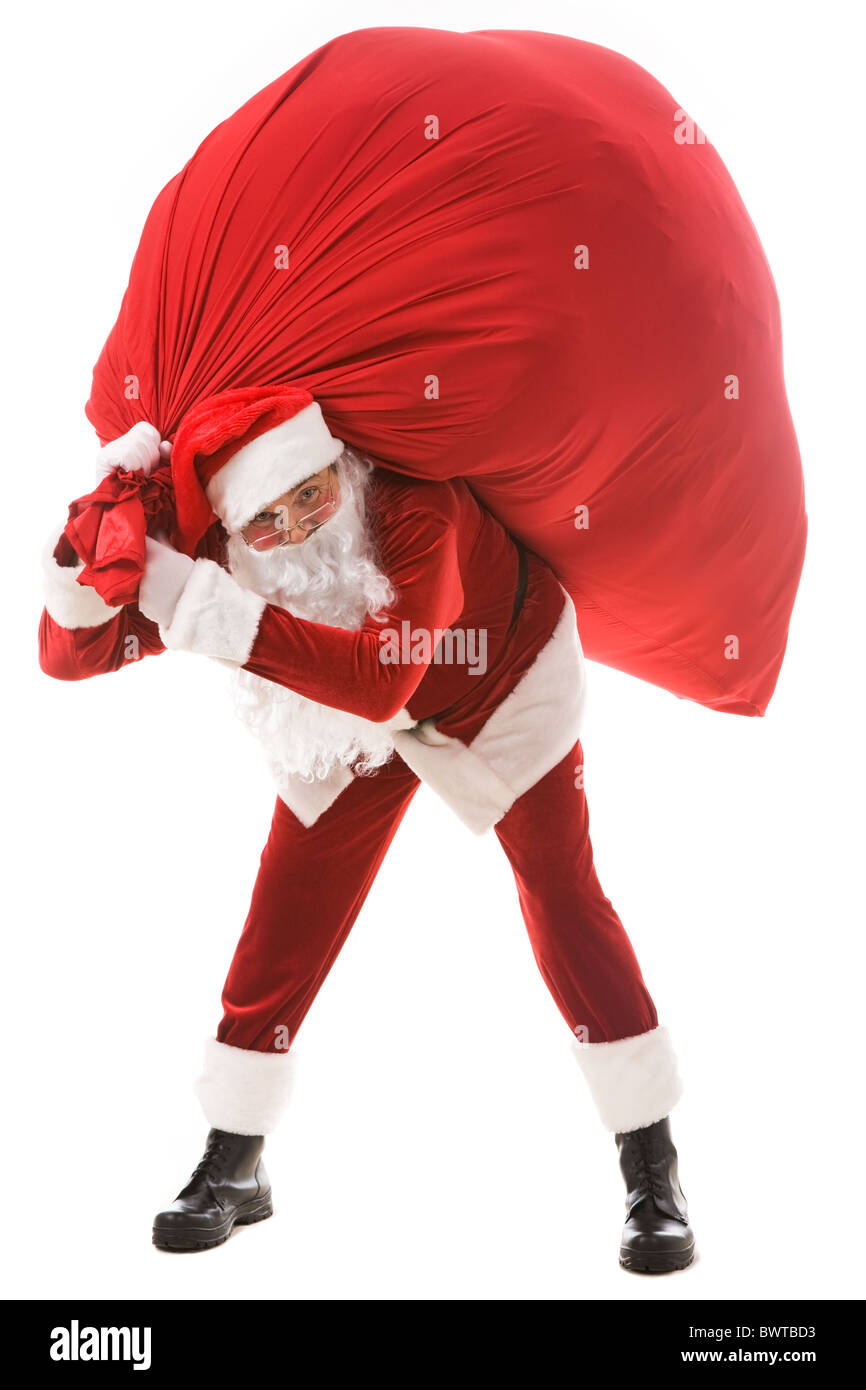 Portrait of strong Santa Claus holding big red sack with presents Stock ...