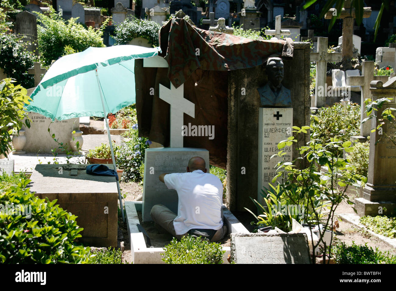 stonemason working on gravestone in protestant cemetery near piramide ...