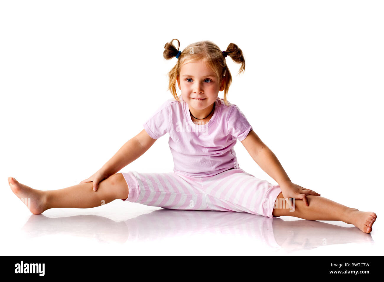 Beautiful girl exercising isolated on white Stock Photo - Alamy