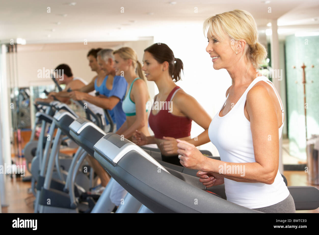 Senior woman running on treadmill hi-res stock photography and images ...