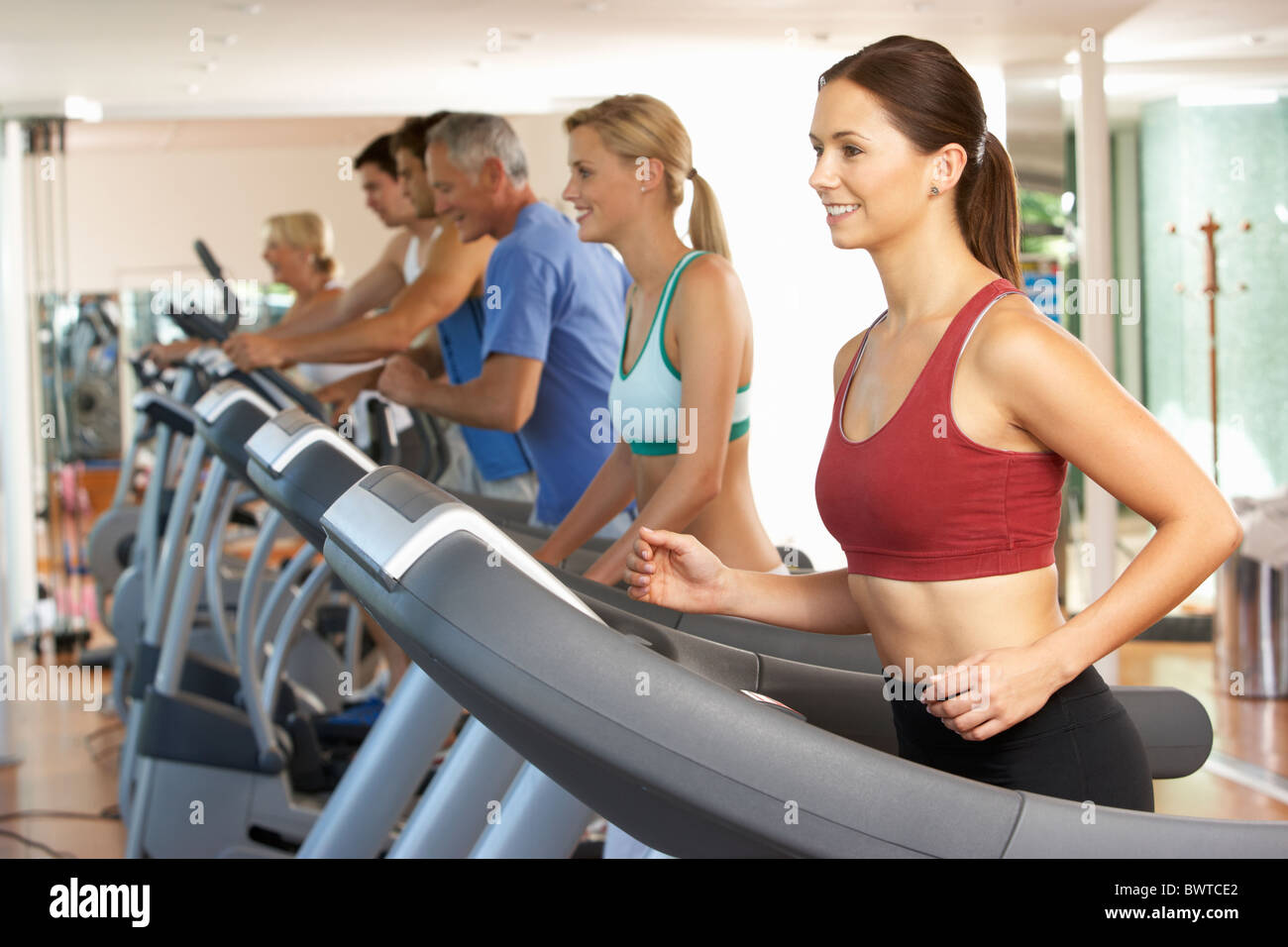 Woman On Running Machine In Gym Stock Photo - Alamy