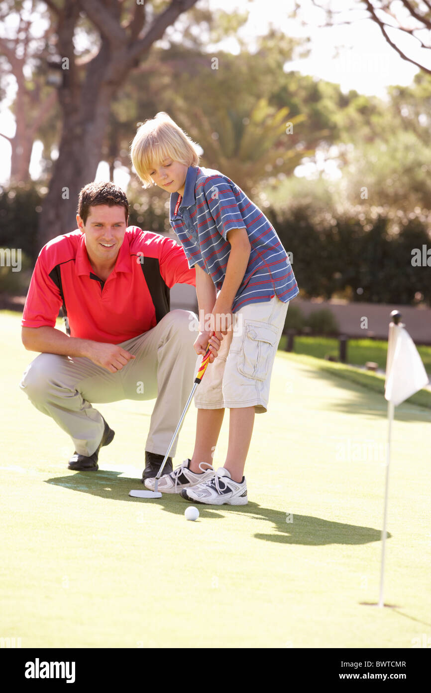 Father son playing golf hi-res stock photography and images - Alamy