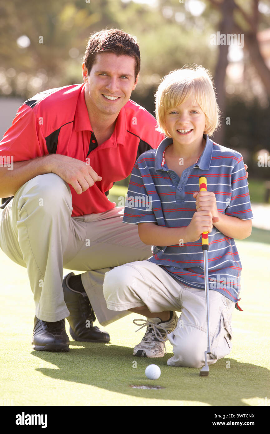 Father teaching son golf hi-res stock photography and images - Alamy