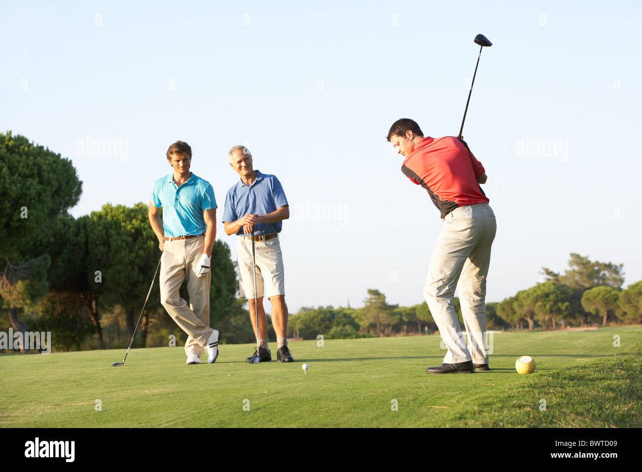 Group, Male Golfers Teeing,f On Golf Course Stock Photo - Alamy