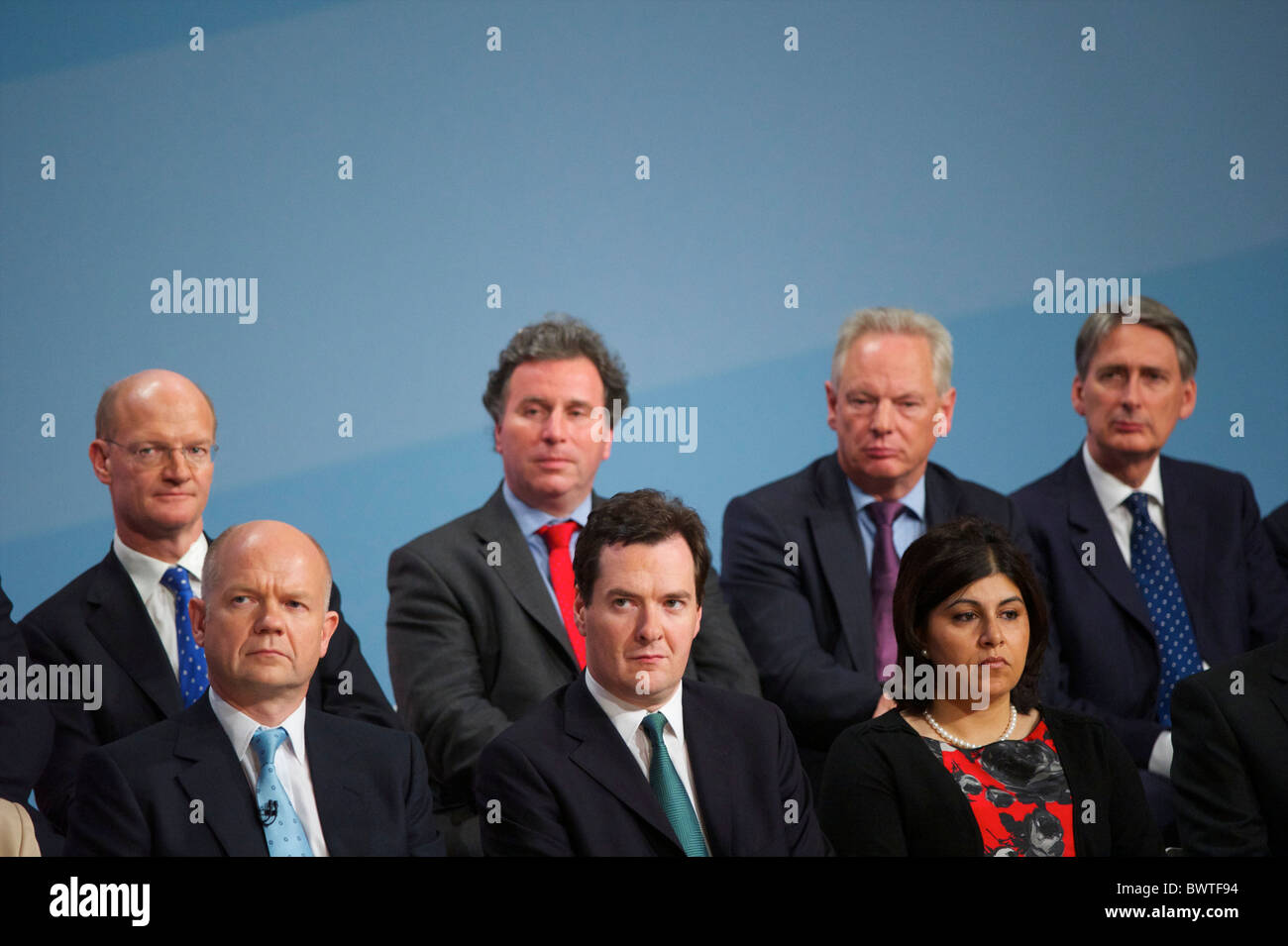 Members of the Prime Minister David Cameron's cabinet listen to his ...