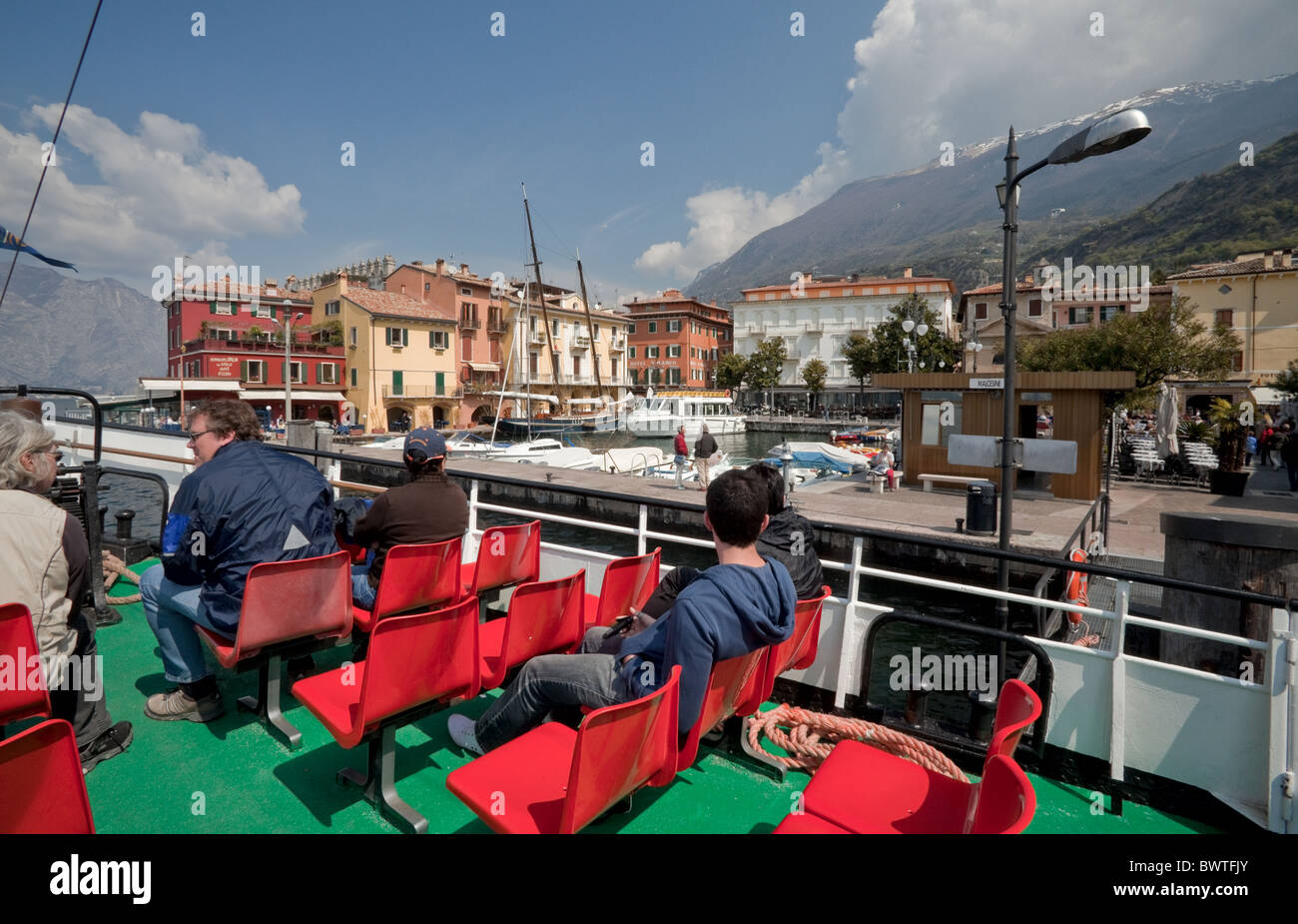 Top deck of lake cruiser on Lake Garda leaving town of Malcesine for ...