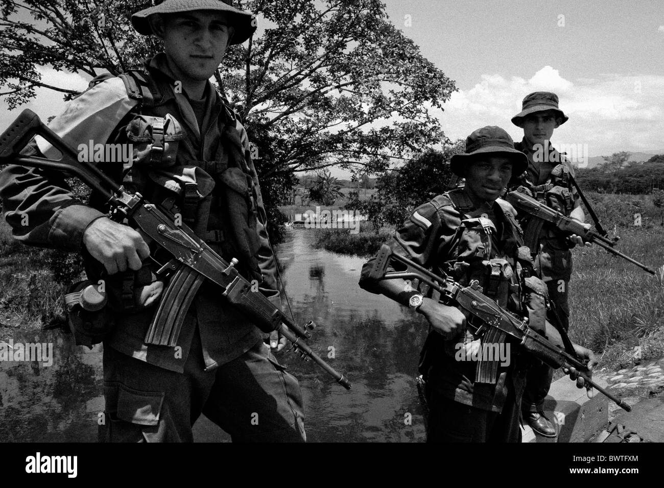 Colombian Police patrol watch over the road checkpoint, Meta Department ...