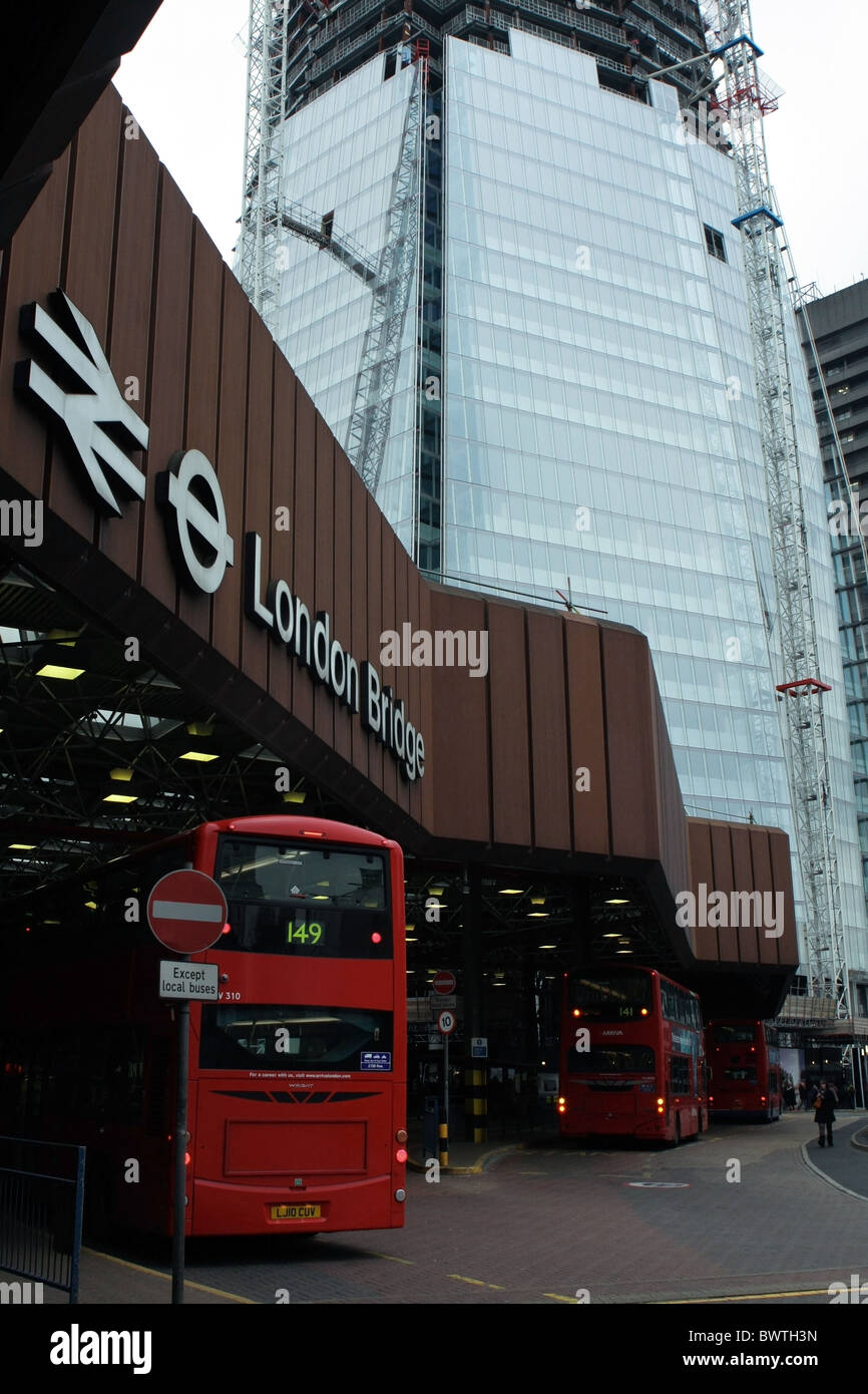 The London Bridge Train station and buses with The Shard of Glass ...
