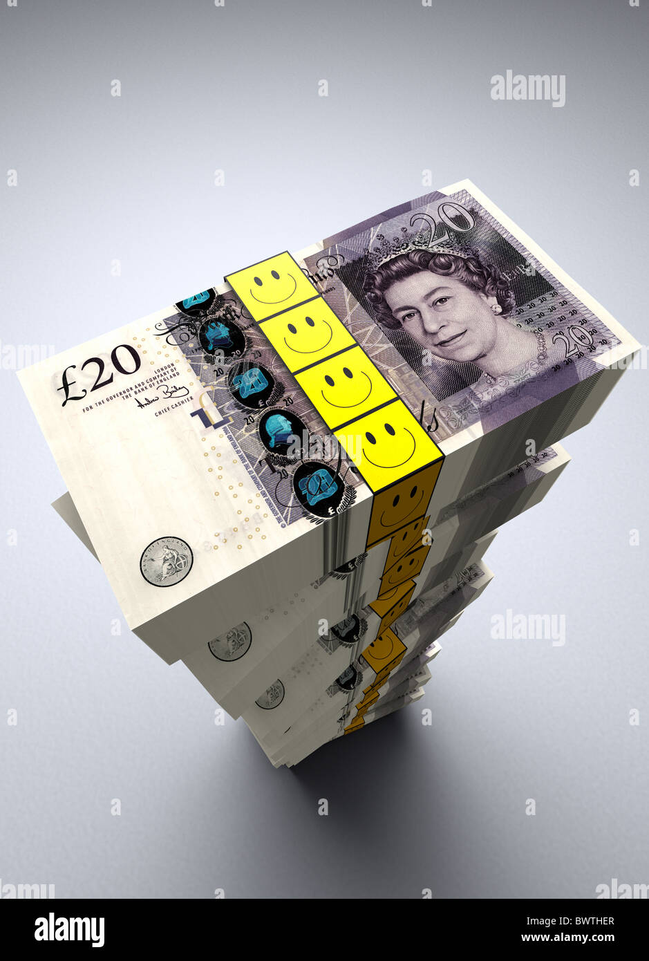 Large stack of English £20 pound bank notes with smiley note ties ...