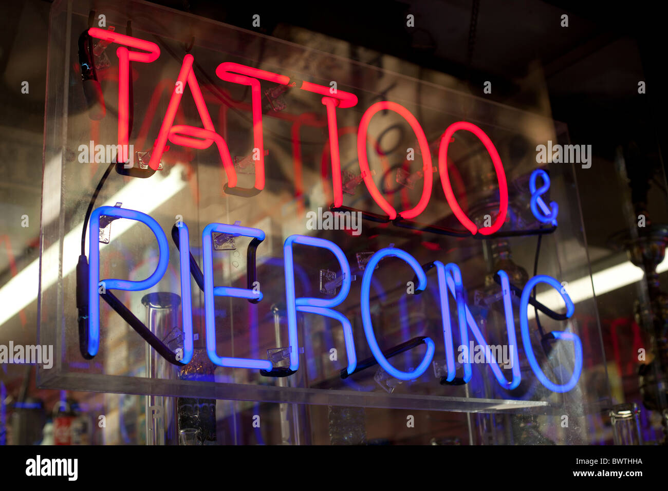 Neon tattoo sign Stock Photo - Alamy
